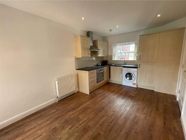 One bedroom top floor flat in the centre of town with allocated parking