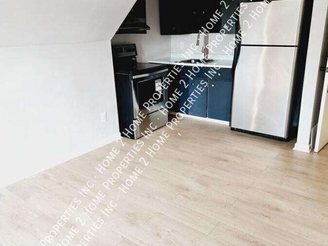 One bedroom unit – steps from the riverside drive | 247 Langlois – Upper Rear