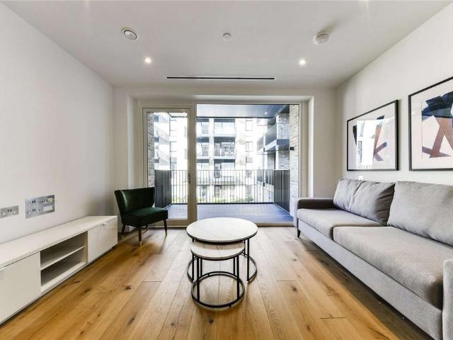 One bedroom apartment with a balcony looking over the residents' private courtyard