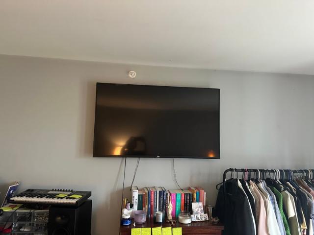 One large room with flat screen and Bathroom