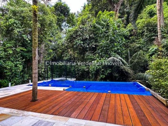 Os segredos e belezas naturais da casa no meio da mata atlântica na praia de Iporanga em Guarujá