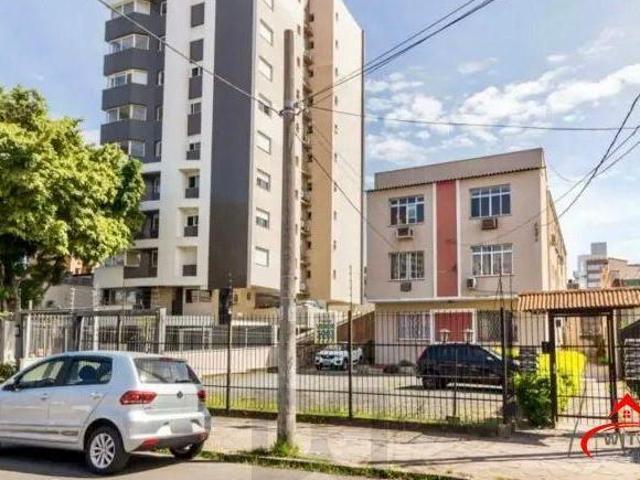 Ótimo apartamento térreo 2 dormitórios, com estacionamento, no coração do Bairro