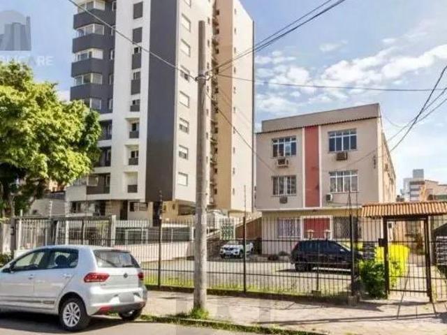 Ótimo apartamento térreo 2 dormitórios, com estacionamento, no coração do Bairro