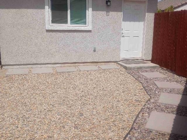 Outdoor space. Fully landscaped front yard with ba