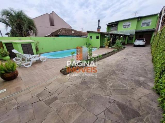 Página 1 Imóveis anuncia linda e aconchegante casa com piscina de 3 dormitórios no bairro São Luís e