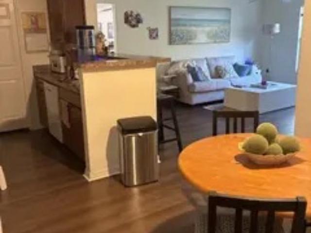 Partially furnished room with a private bathroom