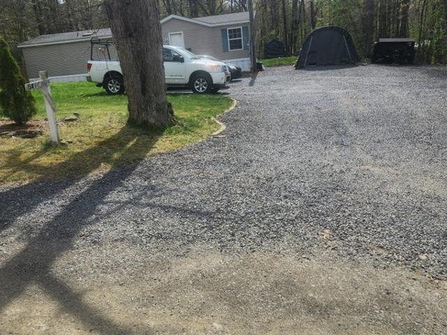 Property is set off main road on private wooded lo