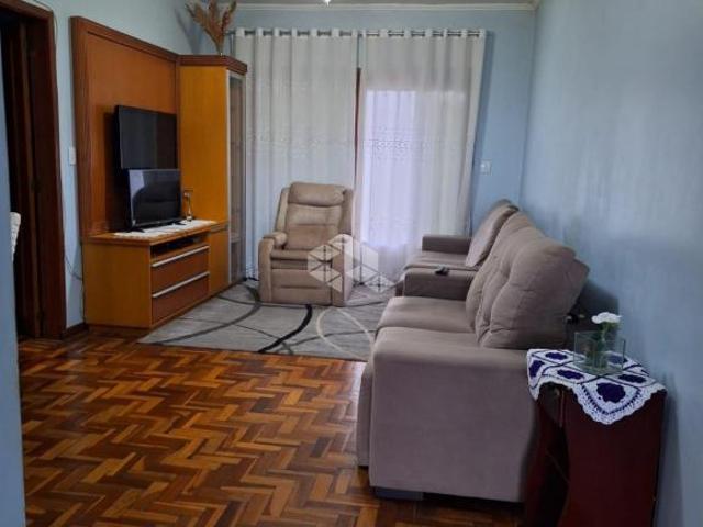 Prédio misto comercial/residencial com 2 apartamentos de 2 dormitórios