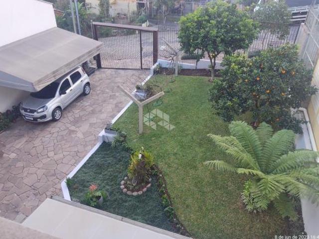 Prédio residencial com 414 m2 3 apartamentos no Bairro De Lazzer Caxias do Sul