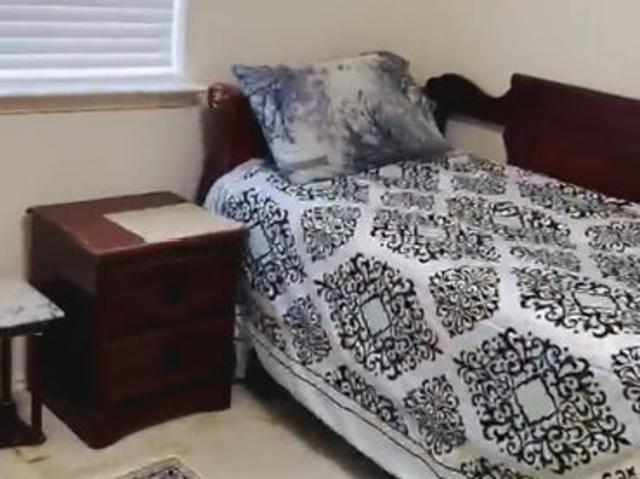 private bedroom with a queen sized bed, large walk