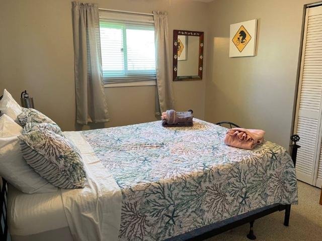 Private furnished bedroom with a bathroom