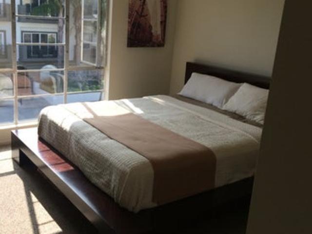 Private furnished bedroom with en suite bathroom