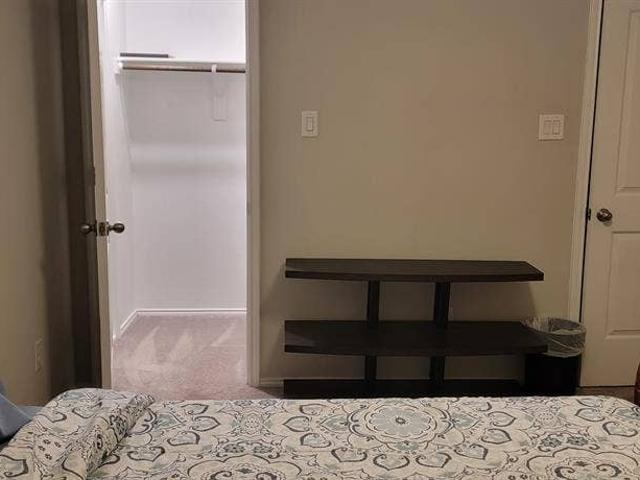 Private furnished bedroom with shar