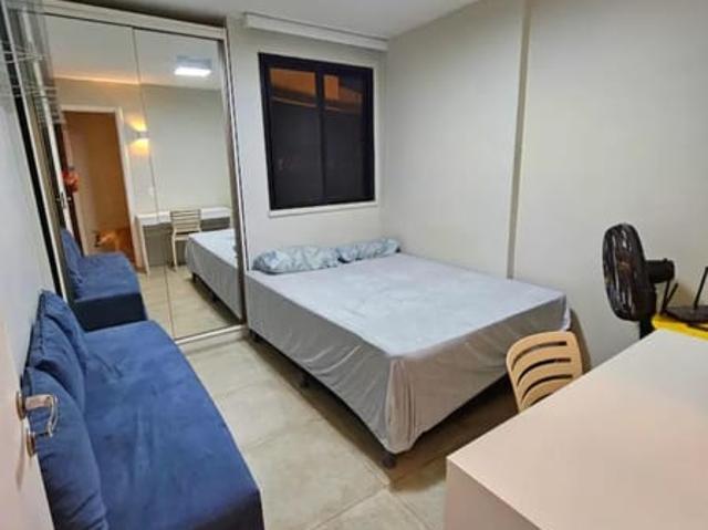 Quarto confortável em ambiente familiar e acolhedor