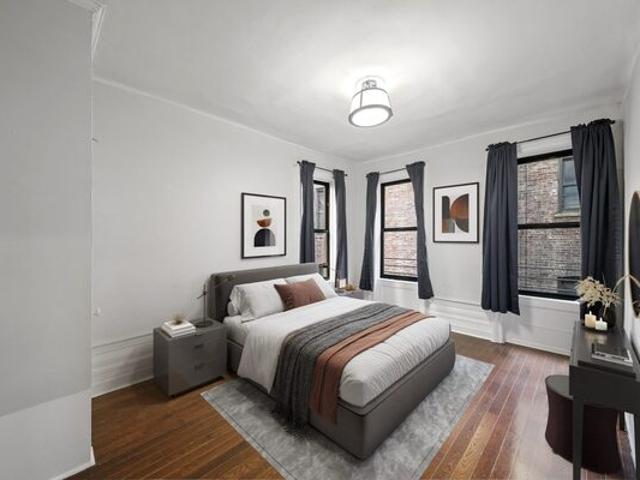 Queen bedroom in 3 bed/1 bath home in Hamilton Heights #594 B