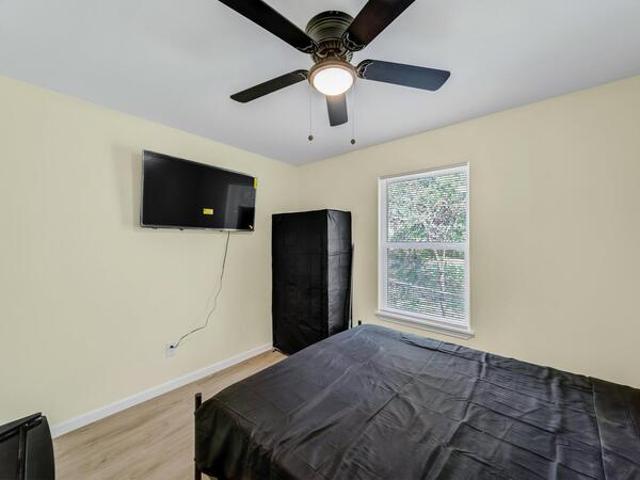 Recently renovated Fort Worth house featuring personal mini fridges per room, 50 TVS, and all the amenities you need!