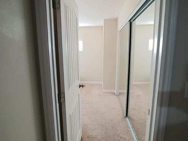 Room with mirrored sliding closet door