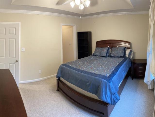 Room with walk in closet and personal bathroom