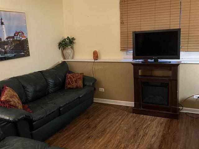 Room w/lower level family room incl