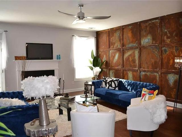 Rooms Available in Hip & Cool Renovation! This luxurious 3 story townhome is one of a kind! The dramatic Custom Industrial Accent Wall in the huge living room sets the tone for this fun and funky renovation.