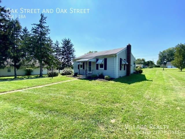 Roomy 1 bedroom Cottage with basement, garage, and sunroom!