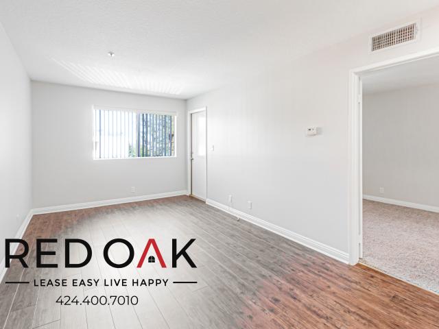~SENIOR LIVING 55+~ Light Filled One Bedroom with Gym, Swimming Pool, On Site Laundry, and Parking Included ~ In Vibrant Huntington Beach!