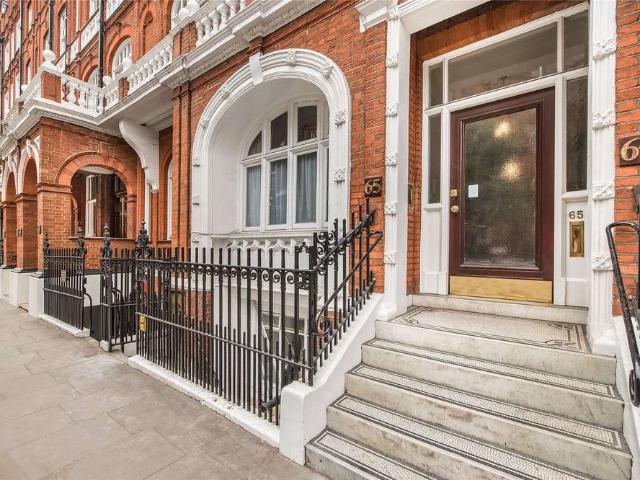 Situated on the raised ground floor of a handsome period building, a spacious two bedroom apartment in a prime Knightsbridge location