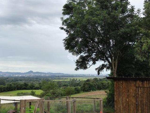 Sitio com casa de 2 dormitórios, com internet a cabo e bela vista, em Nova Santa Rita