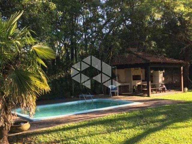 Sítio no Guaíba Country Clube com Casa, Piscina e muita área arborizada Parque Eldorado