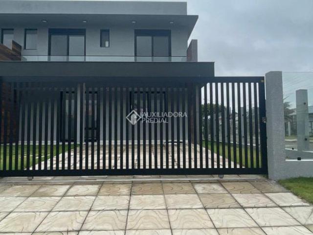 Sobrado moderno com 3 dormitórios, área gourmet e vista para o mar em Xangri Lá