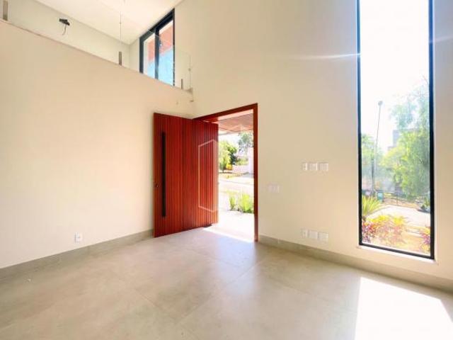 Sobrado novo 380 m² com 5 suítes, pé direito duplo e lazer no Alphaville Arag.