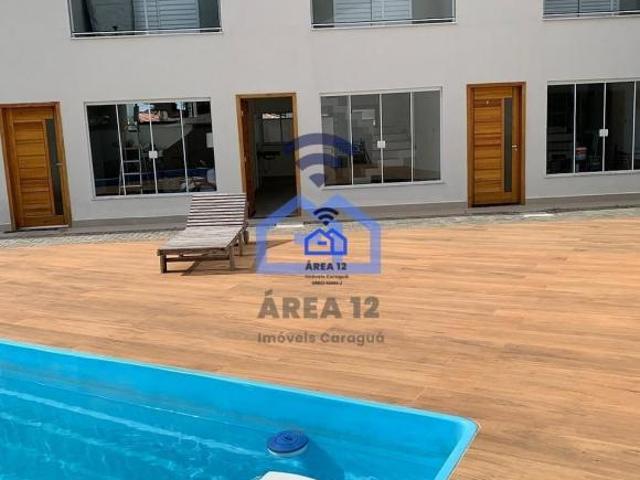Sobrado Novo à venda em condomínio com piscina, a apenas 300m da praia do Massaguaçu em Caraguatatub