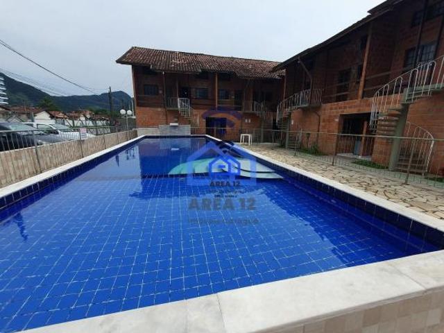 Sobrado à venda em condomínio na Martim de Sá dois dormitórios, sala com 2 ambientes, quintal, vag