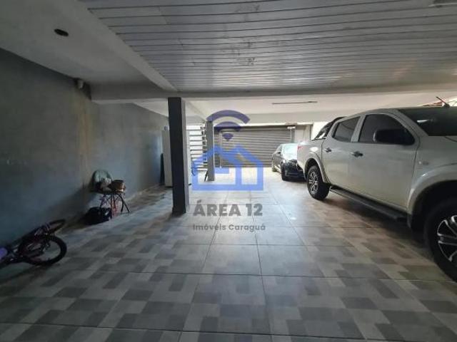 Sobrado à venda no bairro do Aruan em Caraguatatuba, SP Com 7 dormitórios e piscina!
