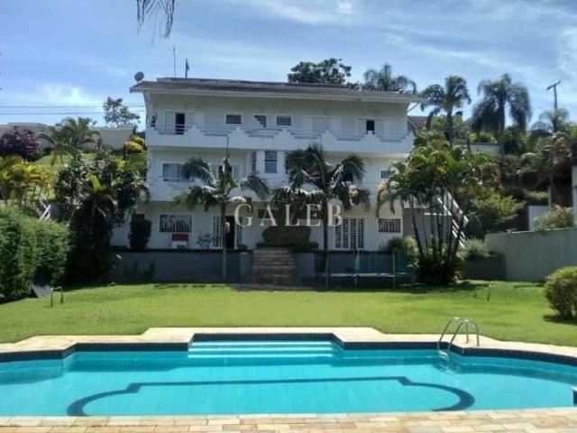 SOBRADO ALTO PADRÃO 5 SUITES CONDOMINIO FLAMBOYANT NA CIDADE
