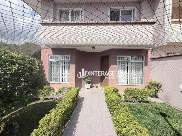 Sobrado com 4 dormitórios à venda, 141 m² por R$ 860.000,00 Novo Mundo Curitiba/PR