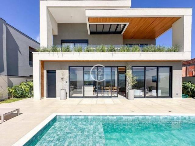 Sobrado com 5 suítes e piscina de borda infinita à venda, 408 m² por R$ 4.800.000 Urbanova São J