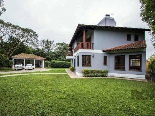 Sobrado com 6 suites, lareira, lavabo, pátio Bairro Belém Velho