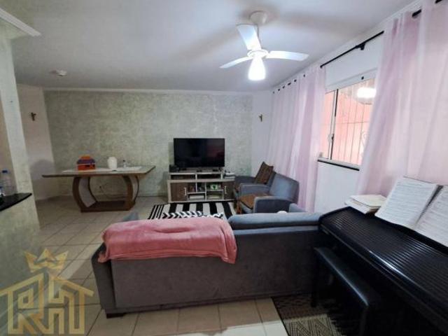 Sobrado com 3 dormitórios à venda, 106 m² por R$ 595.000,00 tude basto Praia Grande/SP
