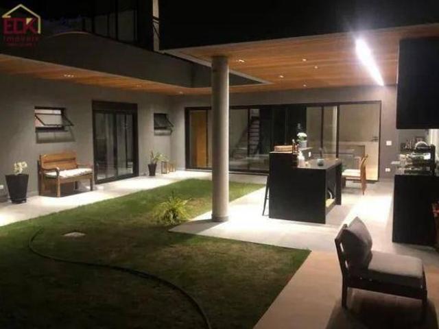 Sobrado com 3 dormitórios à venda, 305 m² por R$ 3.500.000 Condomínio Residencial Colinas do Parat