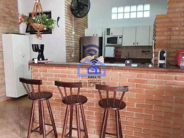 Sobrado com piscina e área gourmet à venda no bairro da Praia das Palmeiras em Caraguatatuba, SP