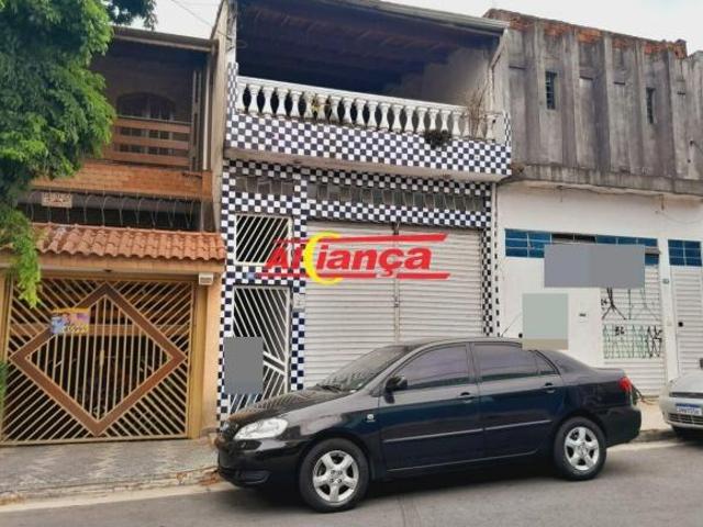 sobrado com salão comercial no térreo
