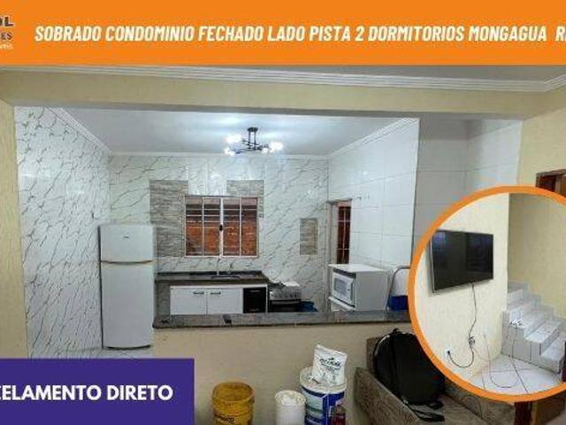 SOBRADO CONDOMINIO FECHADO LADO PISTA 2 DORMITORIOS PARCELAMENTO MONGAGUA
