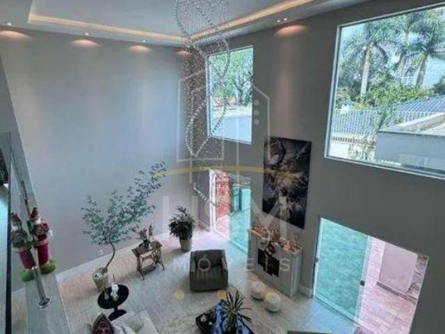 Sobrado de alto padrão com 5 suítes, espaço gourmet completo e 550 m² no Parque
