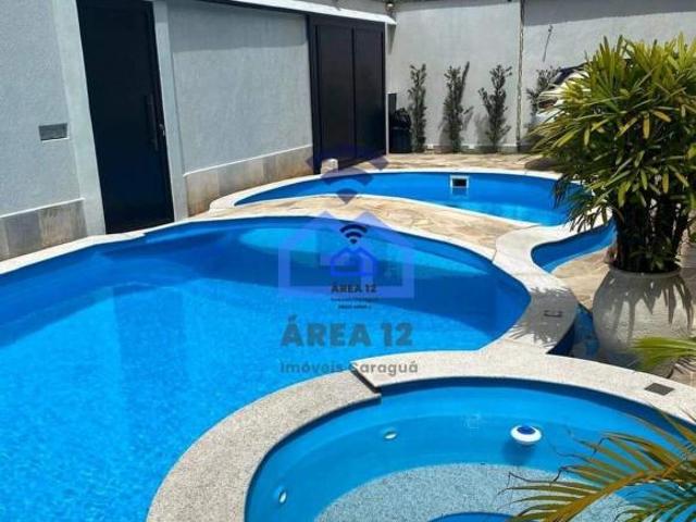 Sobrado triplex frente mar à venda no bairro do Indaiá em Caraguatatuba, SP Com piscina, área gour