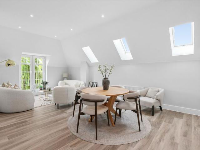 SOLE AGENT* Newly built 2 bed first floor flat with open plan living, lift access, video entry, EV parking, all just steps from Esher High Street & train station