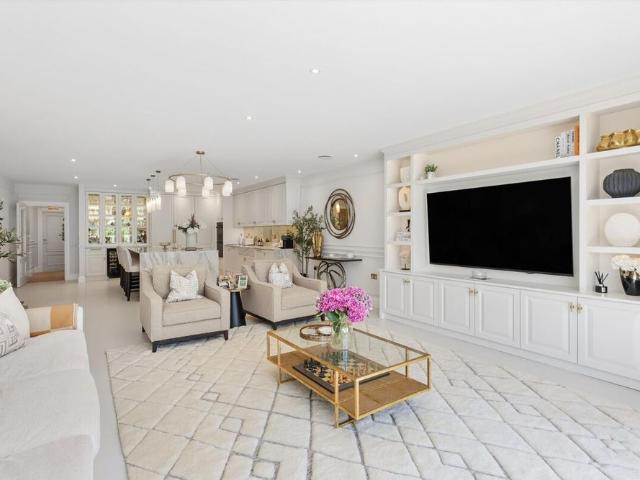 SOLE AGENT* An exceptional luxury apartment in Cobham, offering beautifully appointed two bedroom suites, a private balcony and secure underground parking for two vehicles