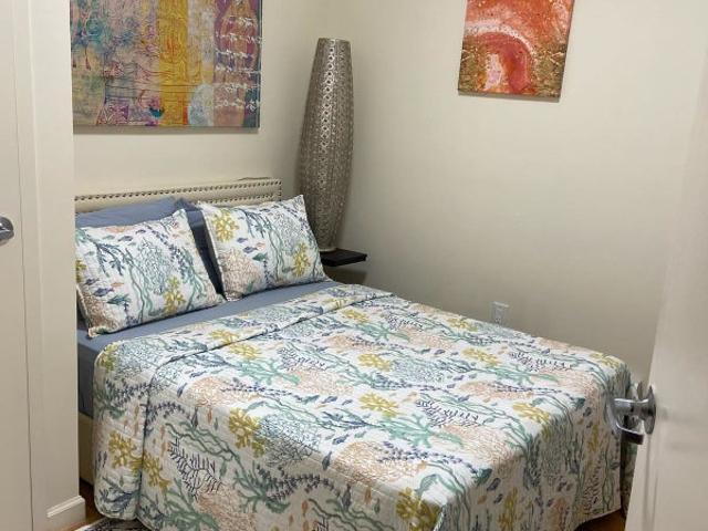 Small furnished bedroom with shared kitchen/bath