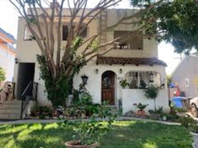 small furnished room in lower spanish style duple