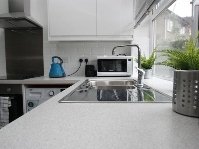 Snug double ensuite bedroom near the White City tube Has a Room